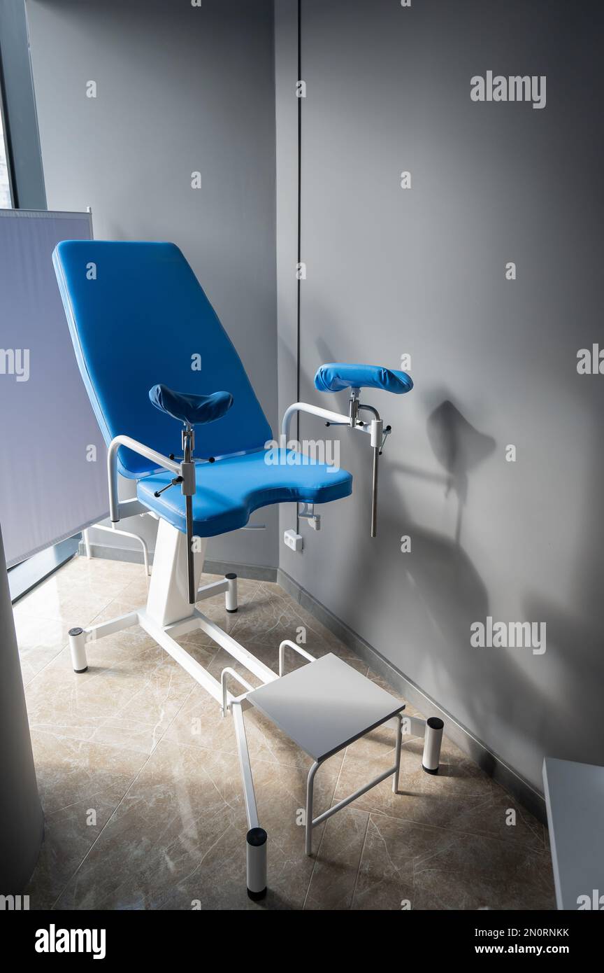 Empty blue gynecological chair in the gynecologist's office Stock Photo ...