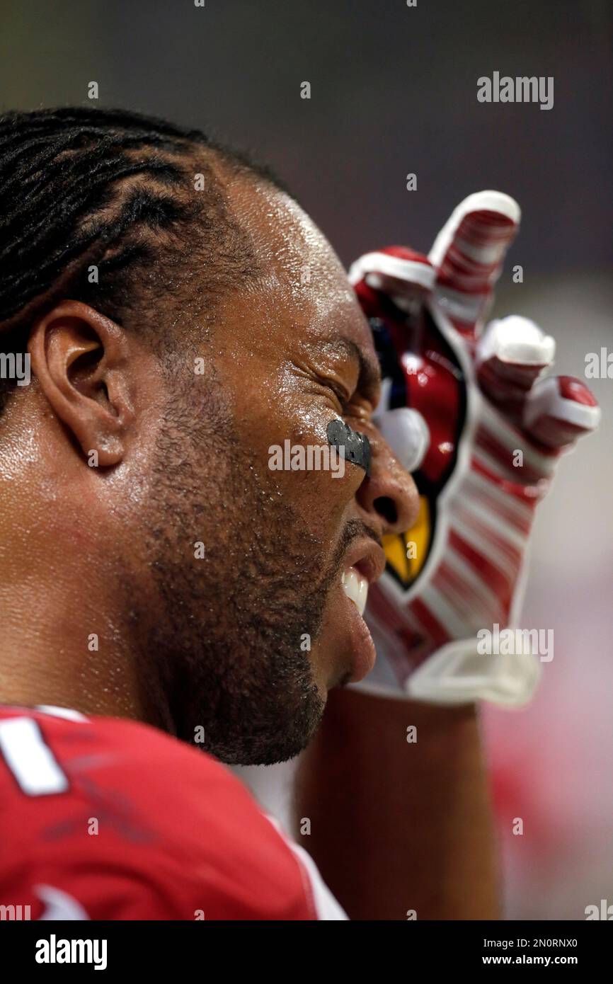 Arizona Cardinals wide receiver Larry Fitzgerald rubs his forehead on ...
