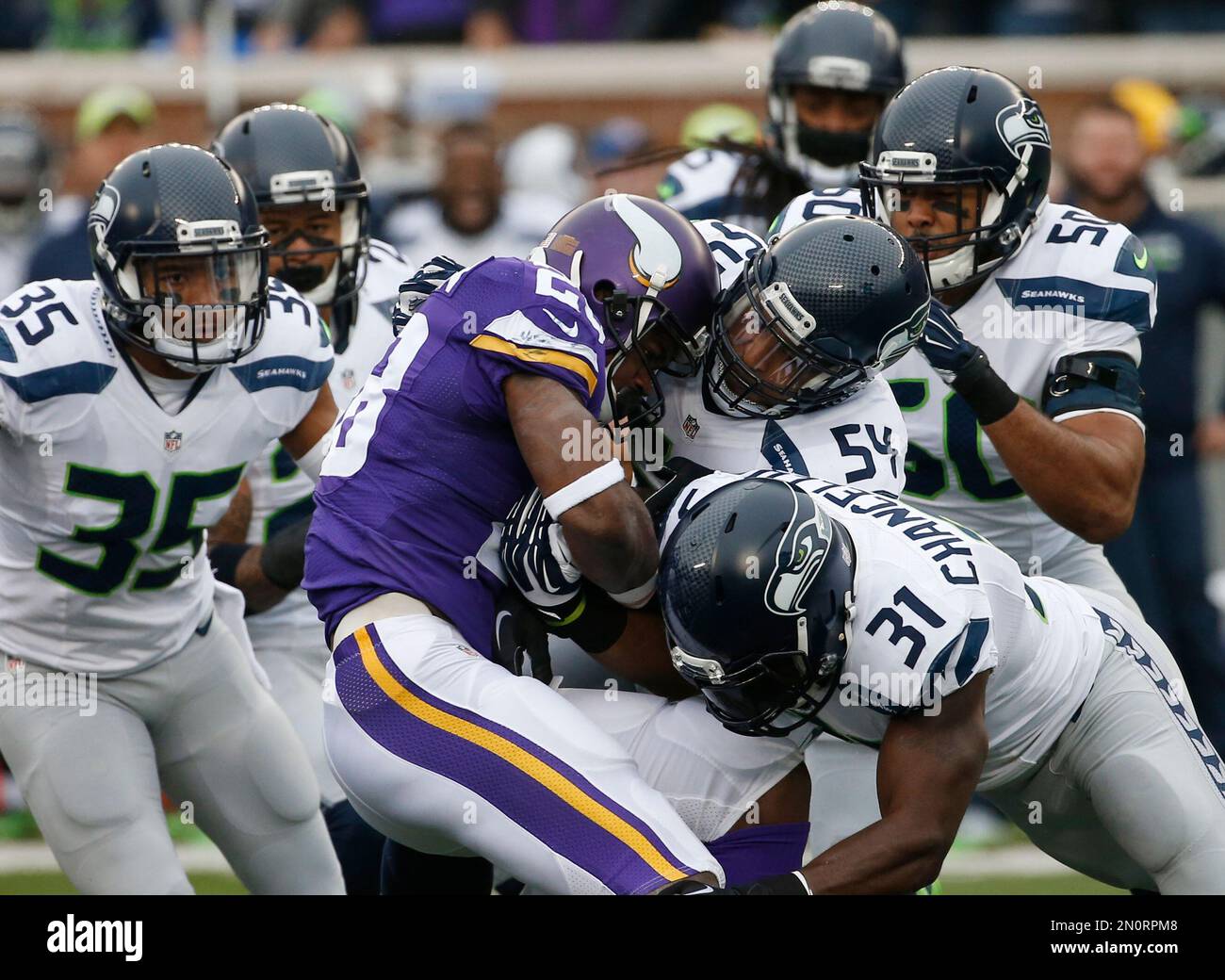 Minnesota Vikings running back Adrian Peterson (28) is stopped by ...