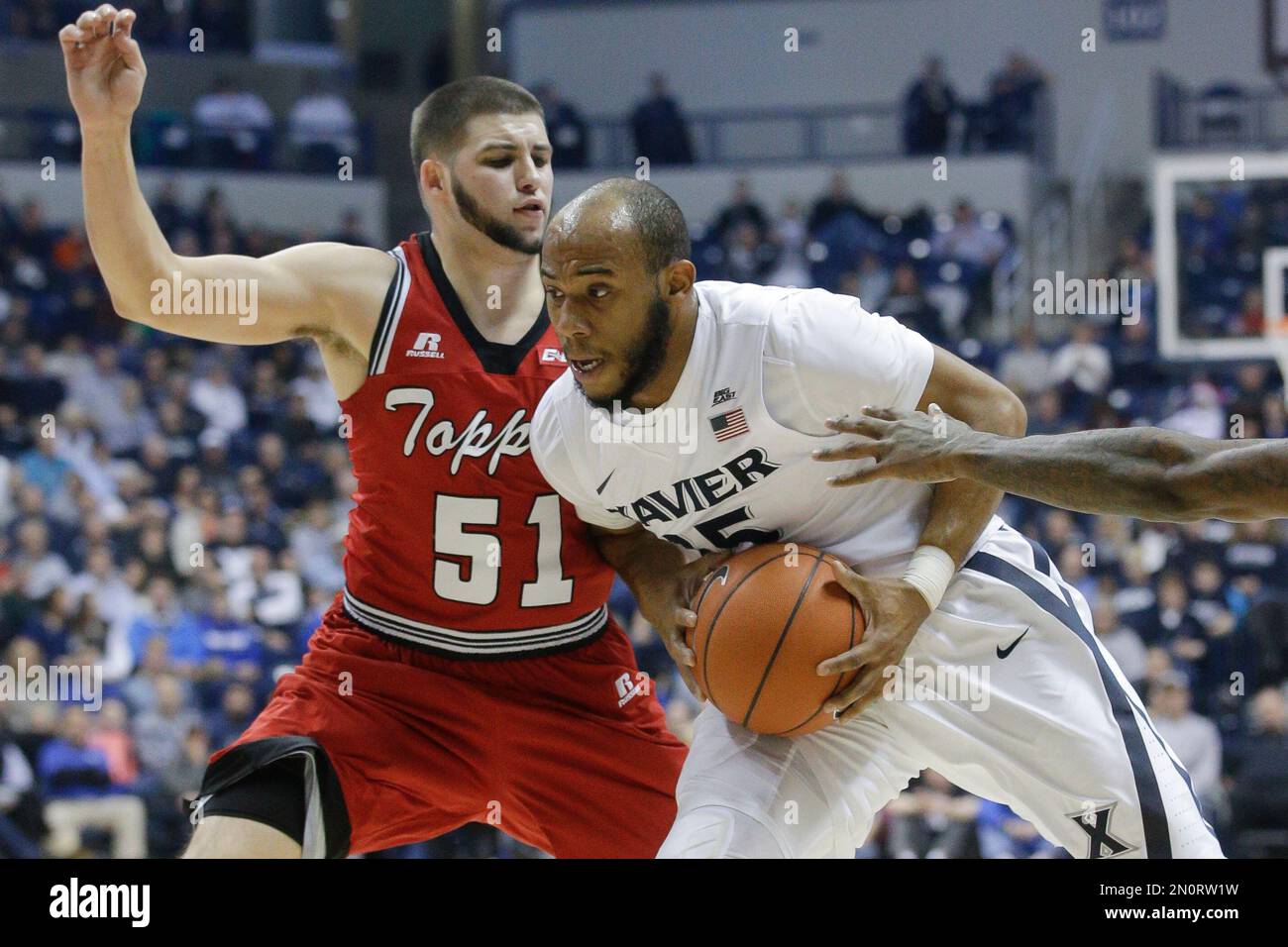 Xavier's Myles Davis (15) drives against Western Kentucky's Chris ...