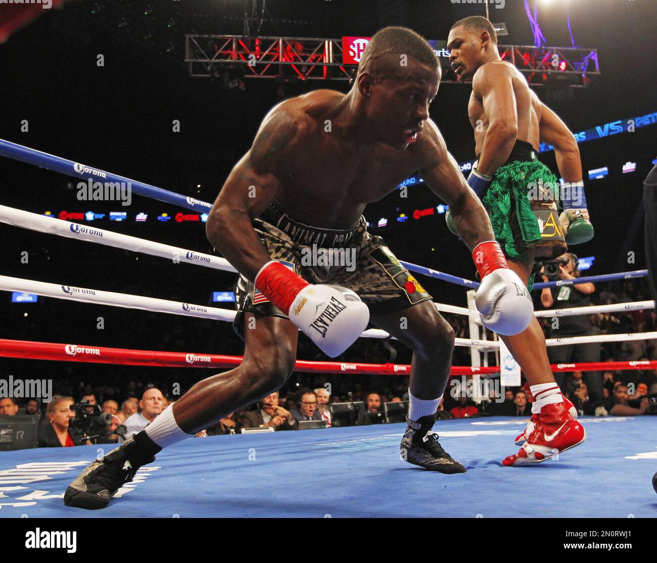 Peter Quillin, left, is knocked out by a right thrown by Daniel Jacobs ...