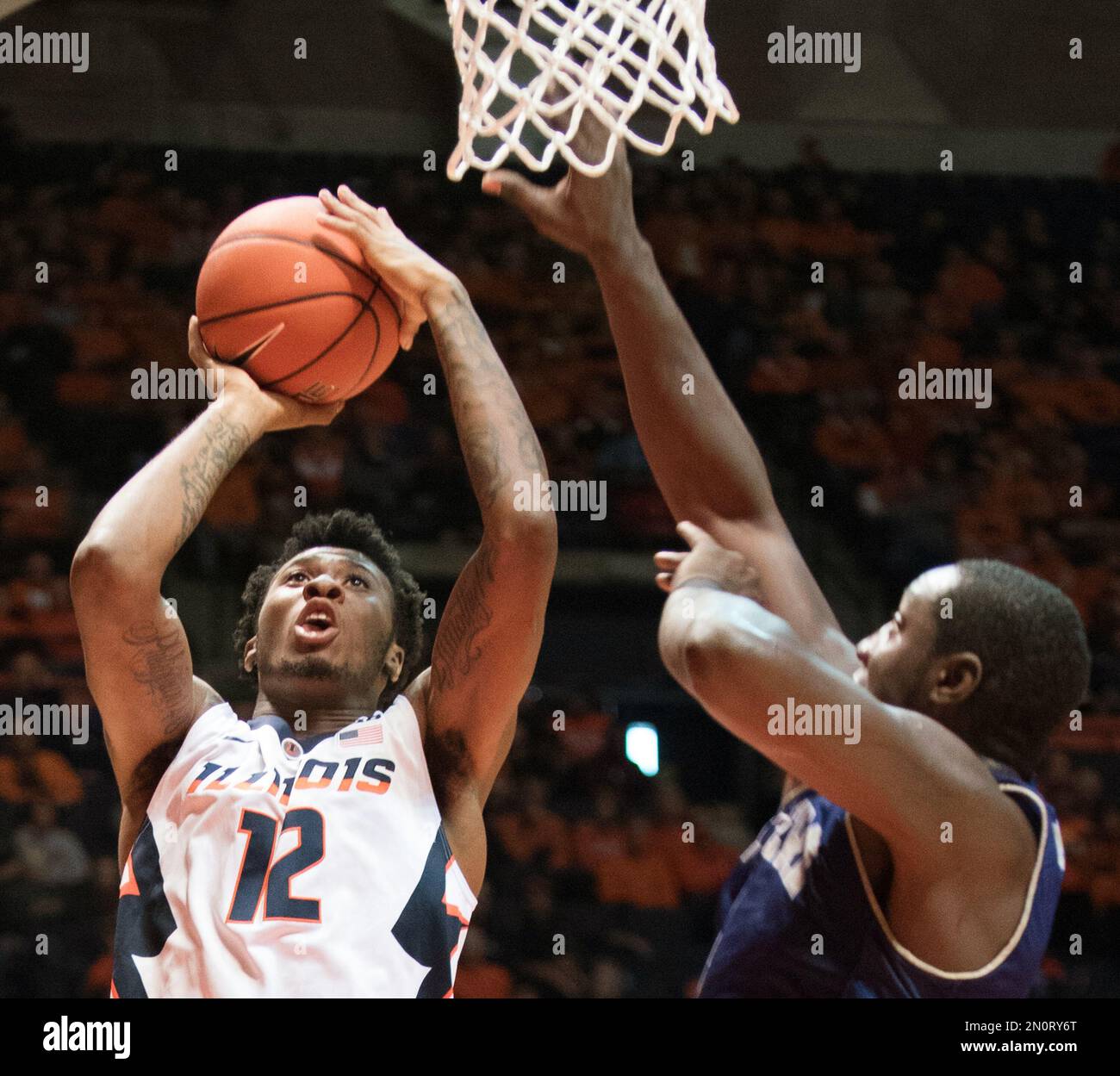 Illinois forward Leron Black (12) shoots over Western Carolina forward ...