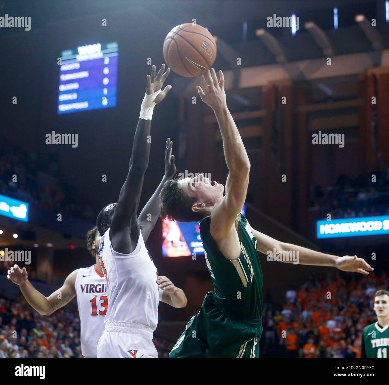 William & Mary guard Omar Prewitt (4) attempts a layup over Virginia ...