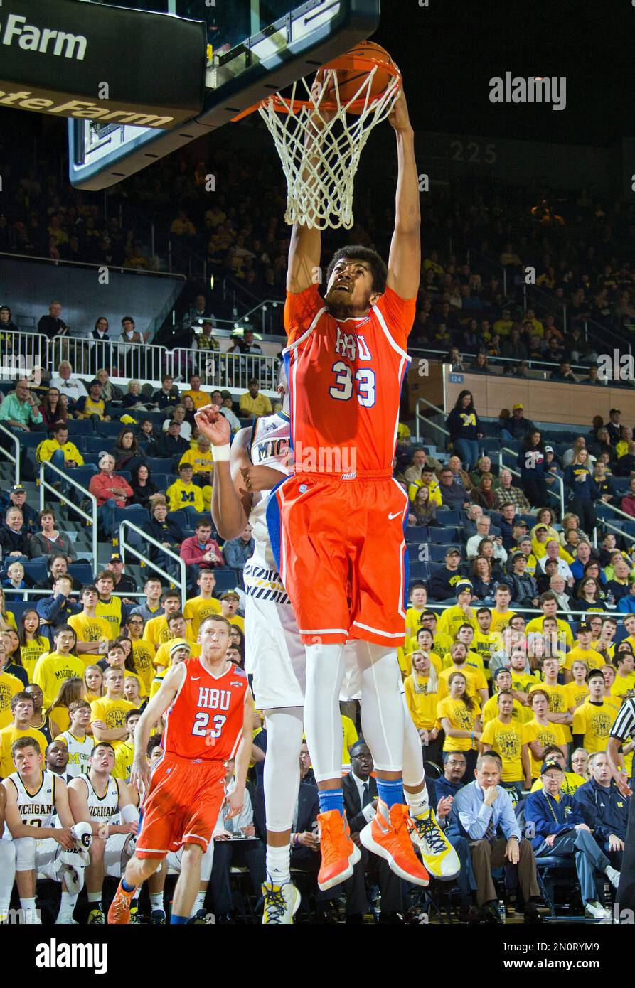 Houston Baptist center Isaiah Robinson (33) makes a dunk in the first ...