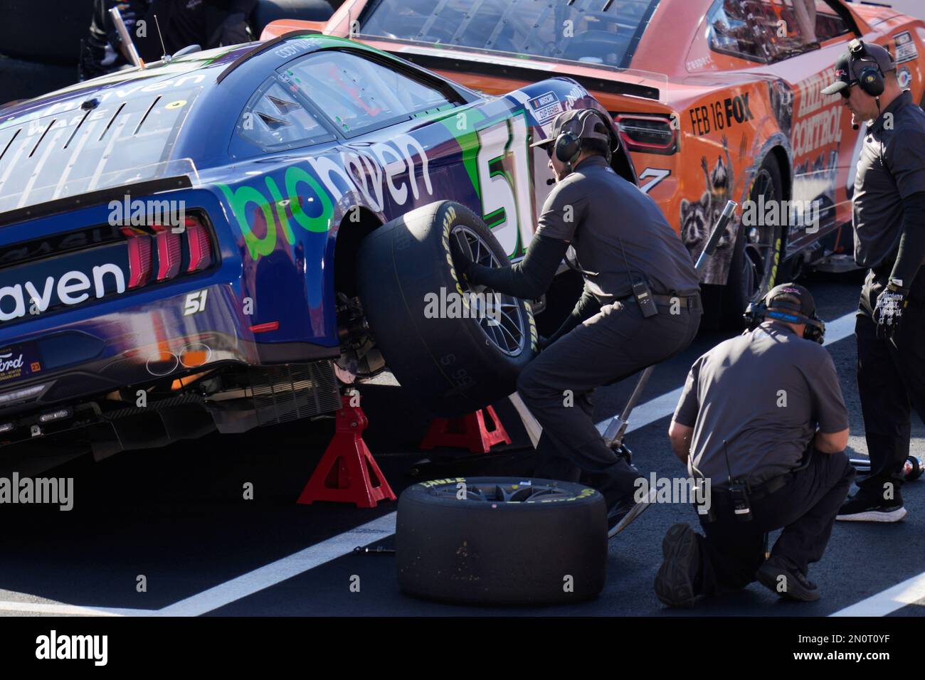 Crews work on a car belonging to NASCAR Cup Series driver Cody Ware (51 ...