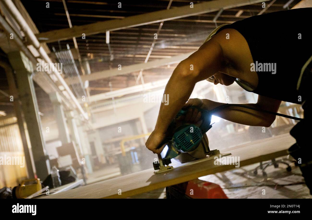 In this Oct. 5, 2015 photo, Alexander Brogan, 18, saws through a sheet ...