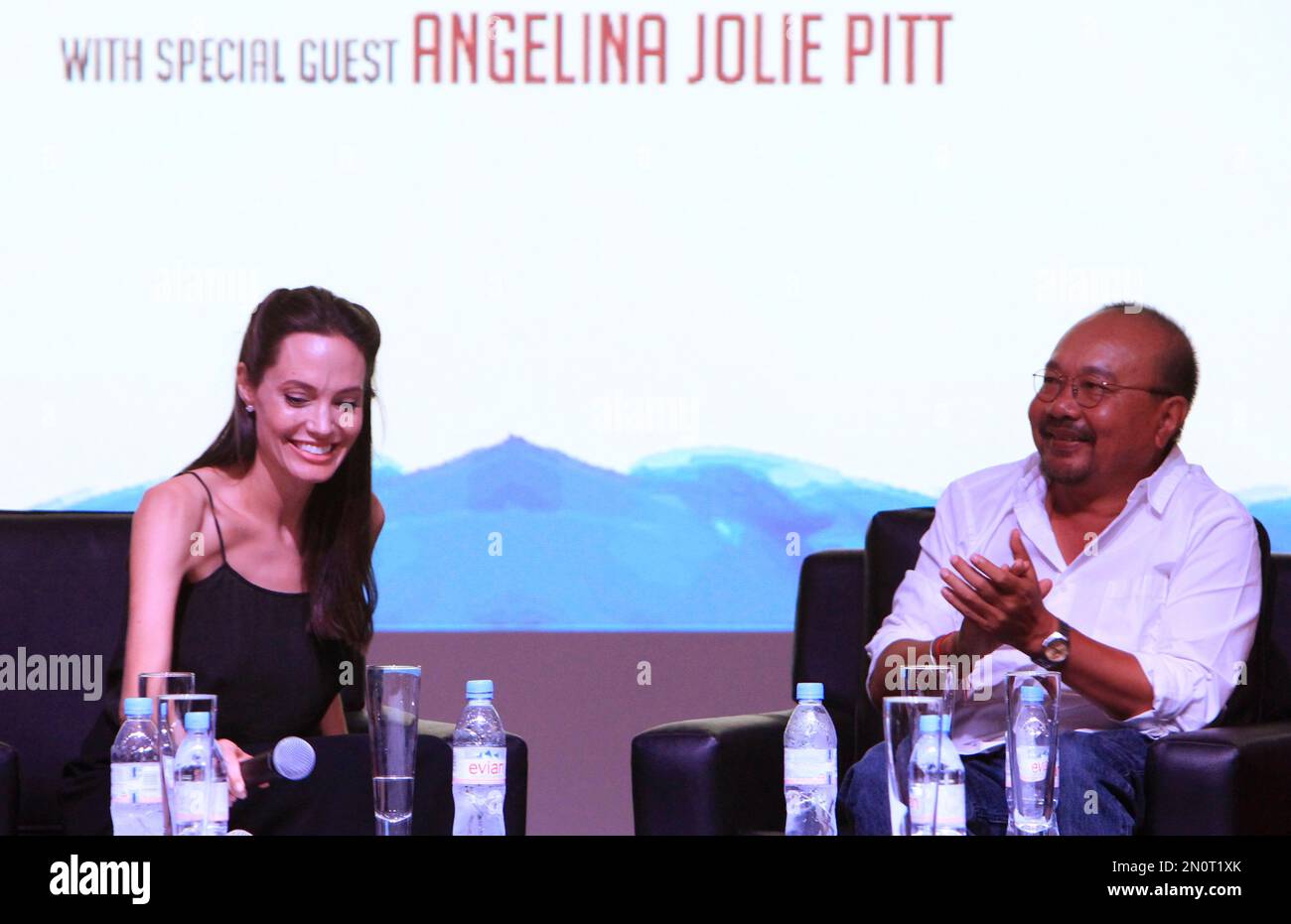 Angelina Jolie, left, smiles as Cambodian film maker Rithy Panh, right ...
