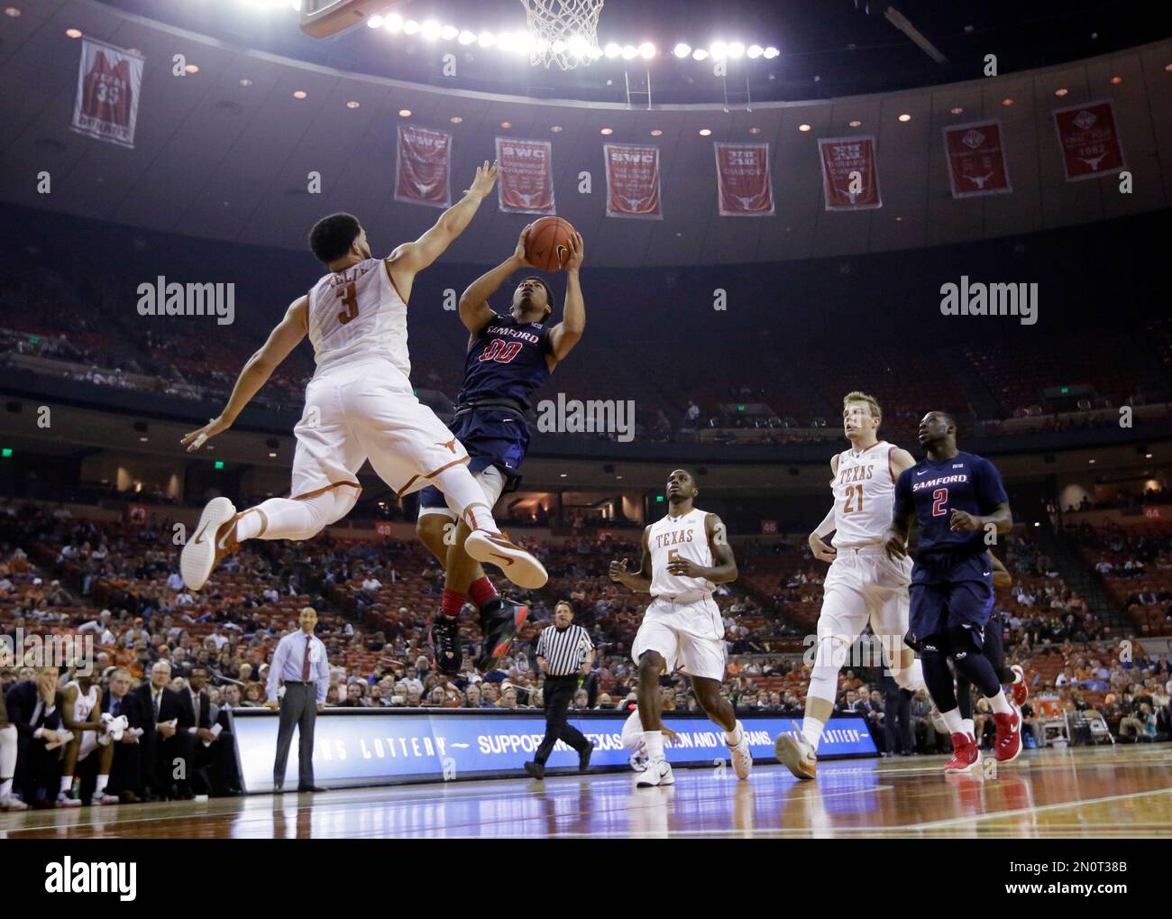 Samford guard Christen Cunningham (00) shoots over Texas guard Javan ...