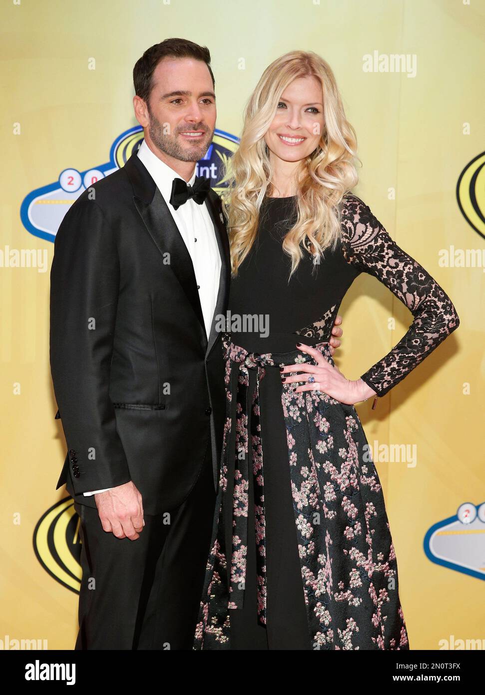 Jimmie Johnson and his wife, Chandra ,pose on the red carpet before the ...