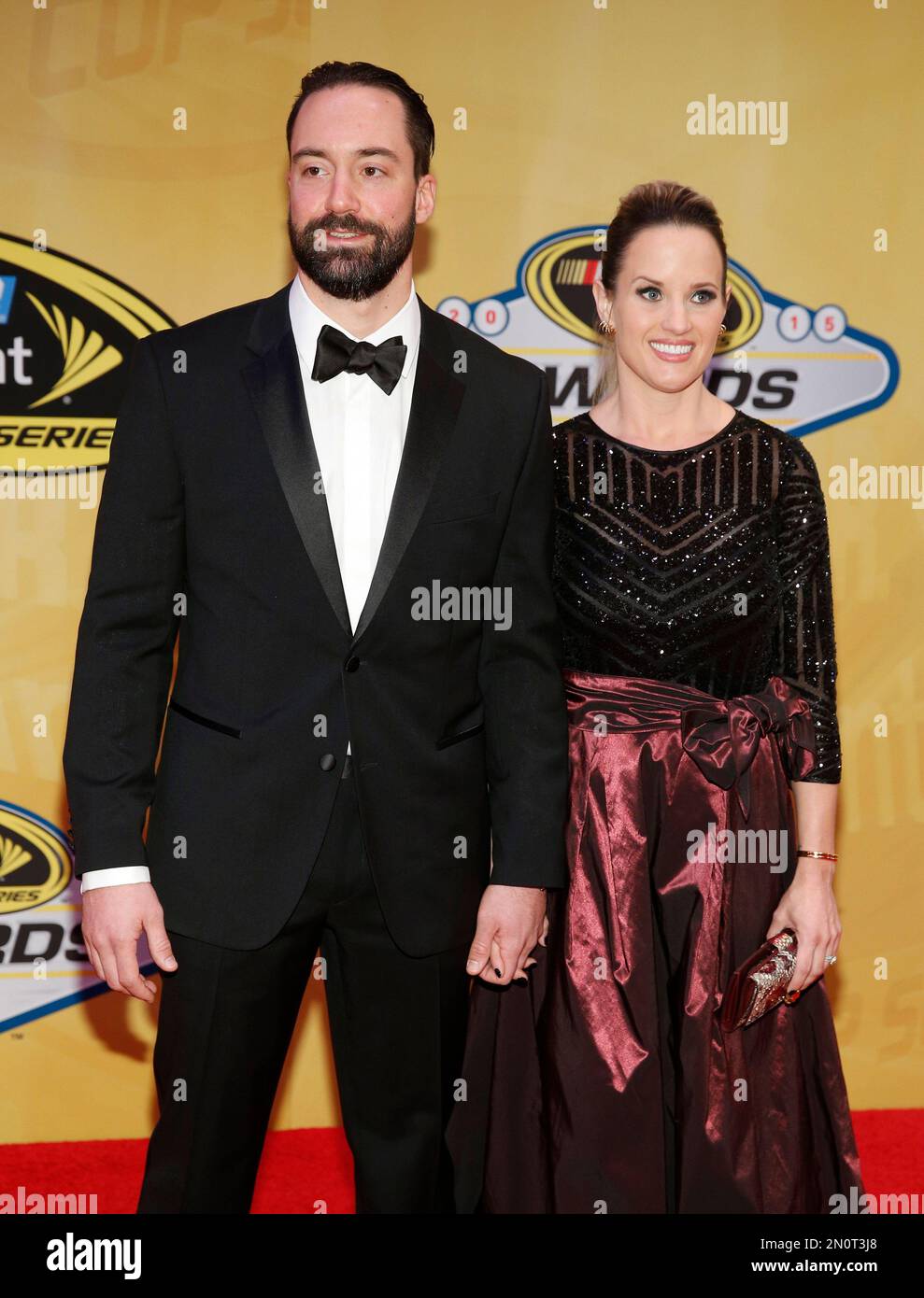 Paul Menard and his wife, Jennifer, pose on the red carpet before the ...