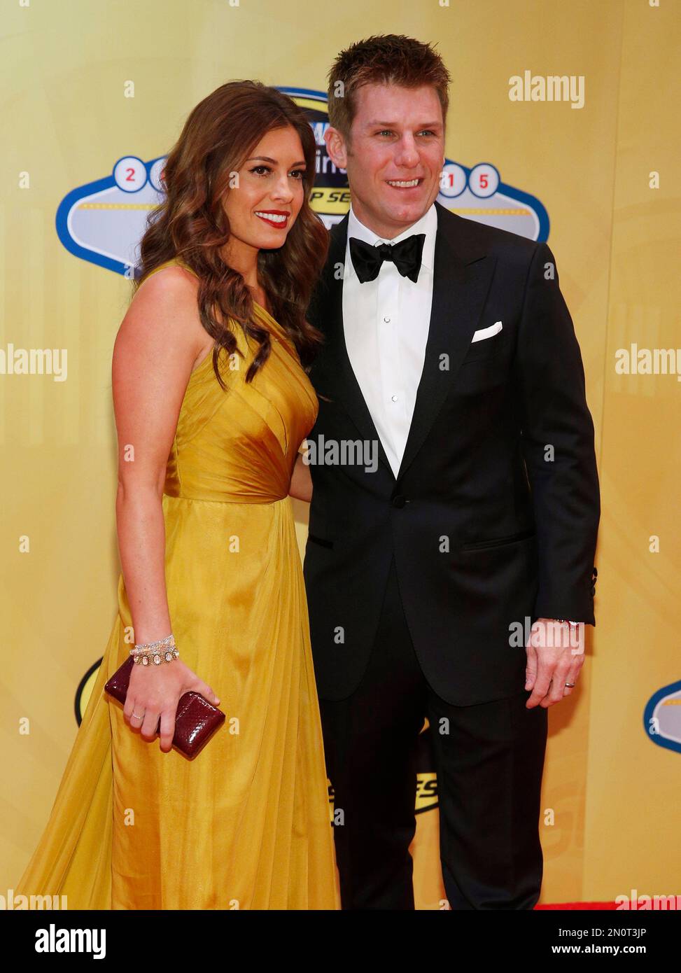 Jamie McMurray and his wife, Christy, pose on the red carpet before the ...
