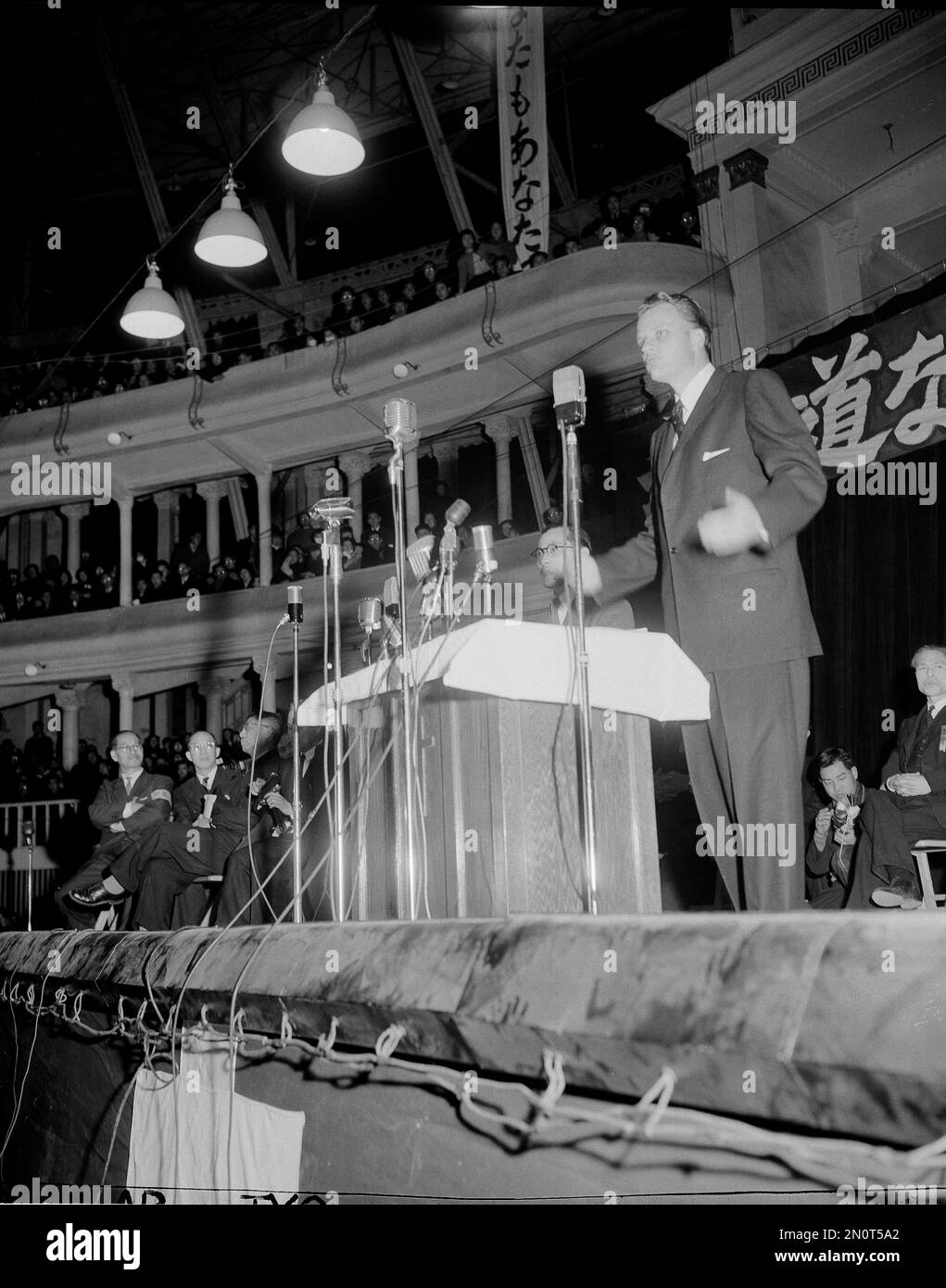 American evangelist Billy Graham speaks during one of his crusades to a ...