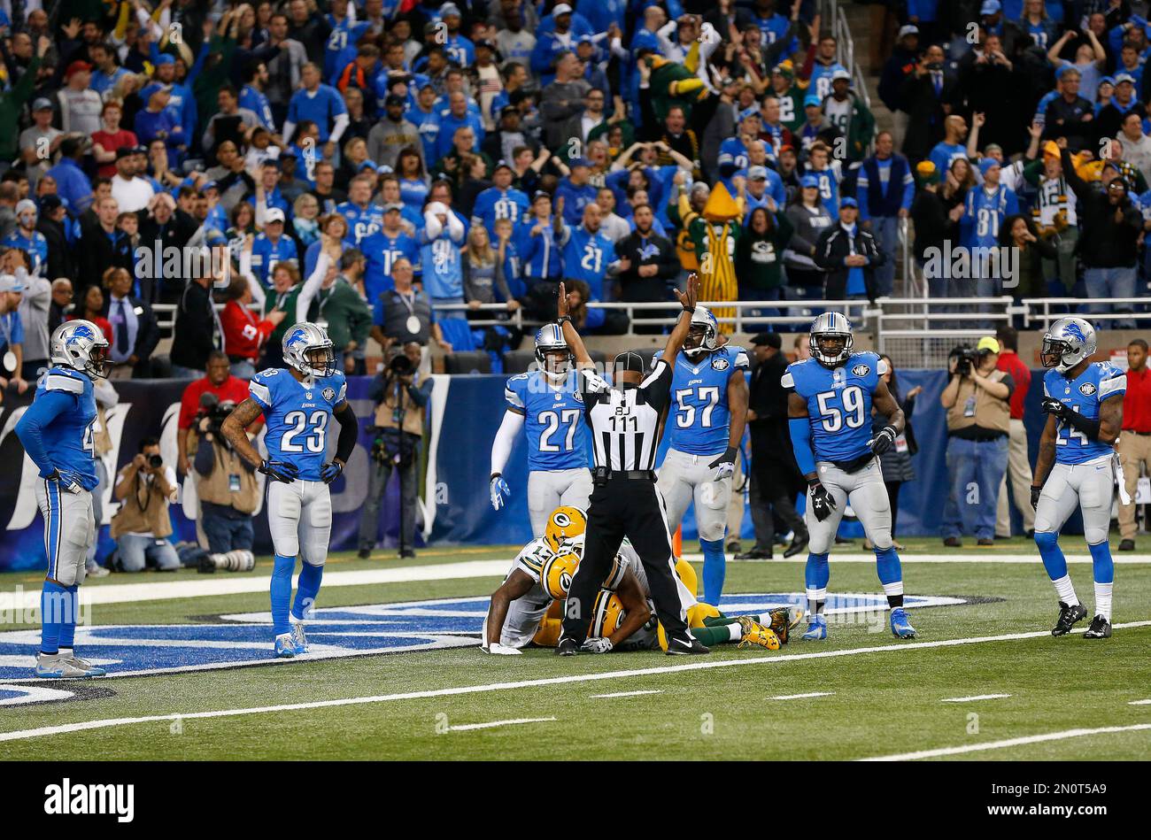 Back judge Terrence Miles signals a touchdown as Green Bay Packers ...