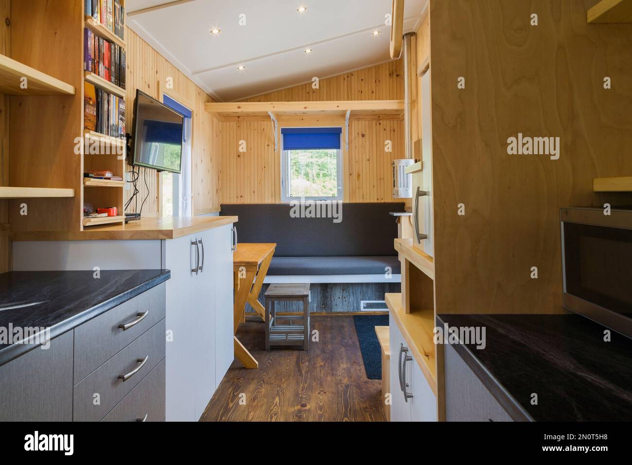 Black arborite kitchen countertops, grey and white melamine cabinets ...