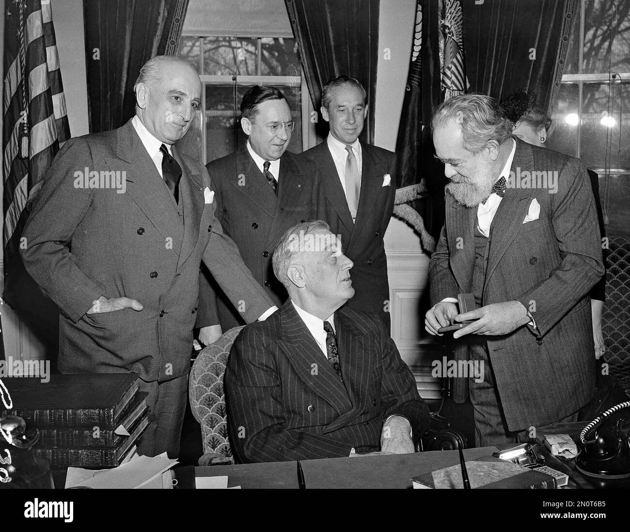 President Franklin D. Roosevelt looks at the inaugural medal, to be ...