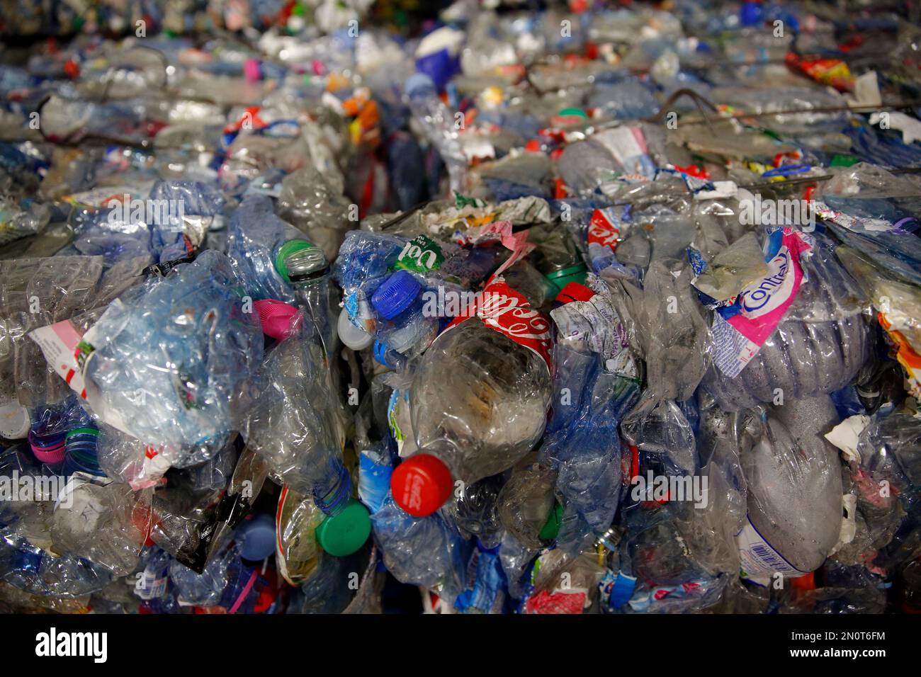 Plastic bottles are compacted at Syctom plant, in Paris, Friday, Dec. 4 ...