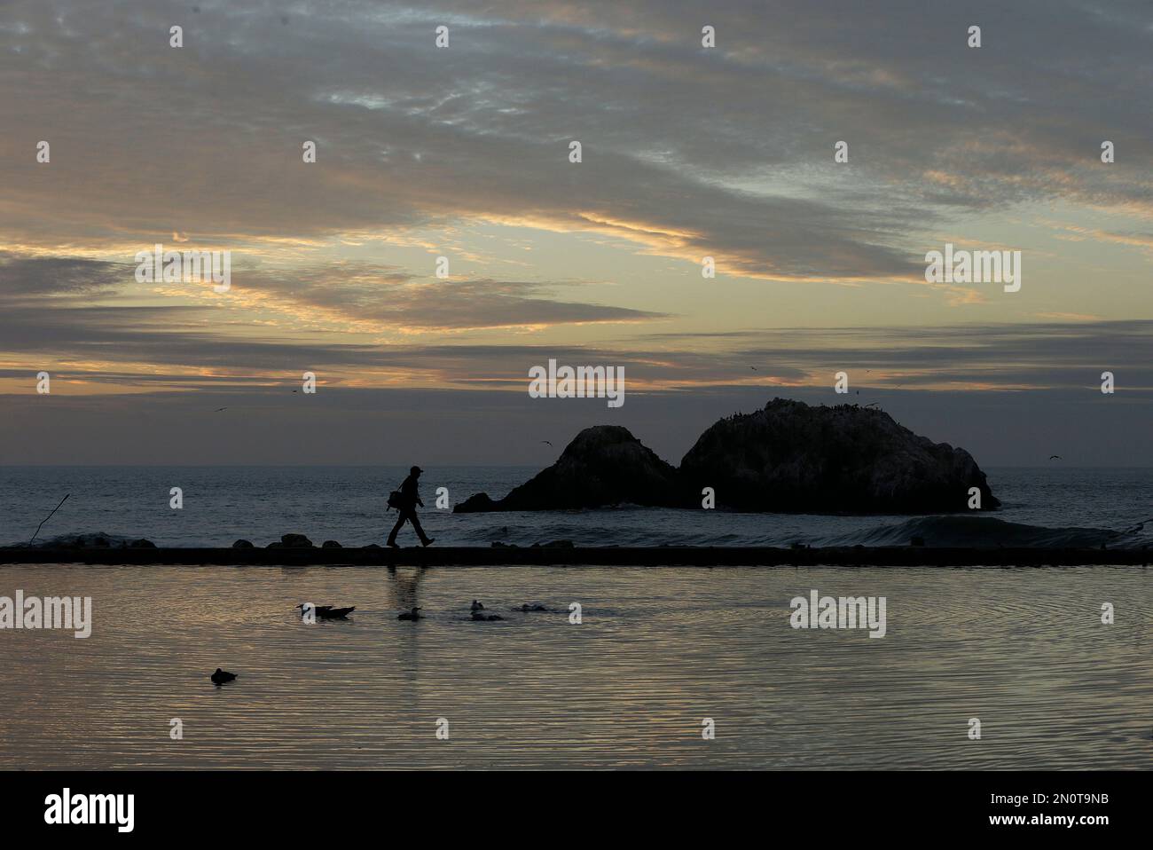 A man walks along the edge of the historic Sutro Baths, once the world ...