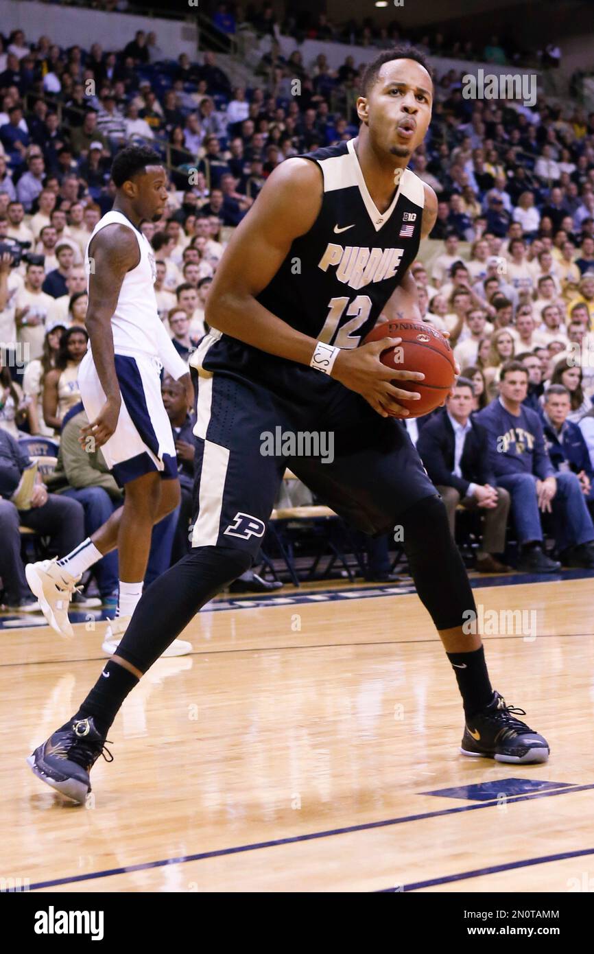 Purdue's Vince Edwards (12) plays in an NCAA college basketball game ...