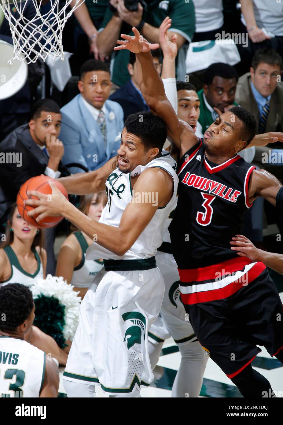 Michigan State's Kenny Goins, left, pulls down a rebound against ...