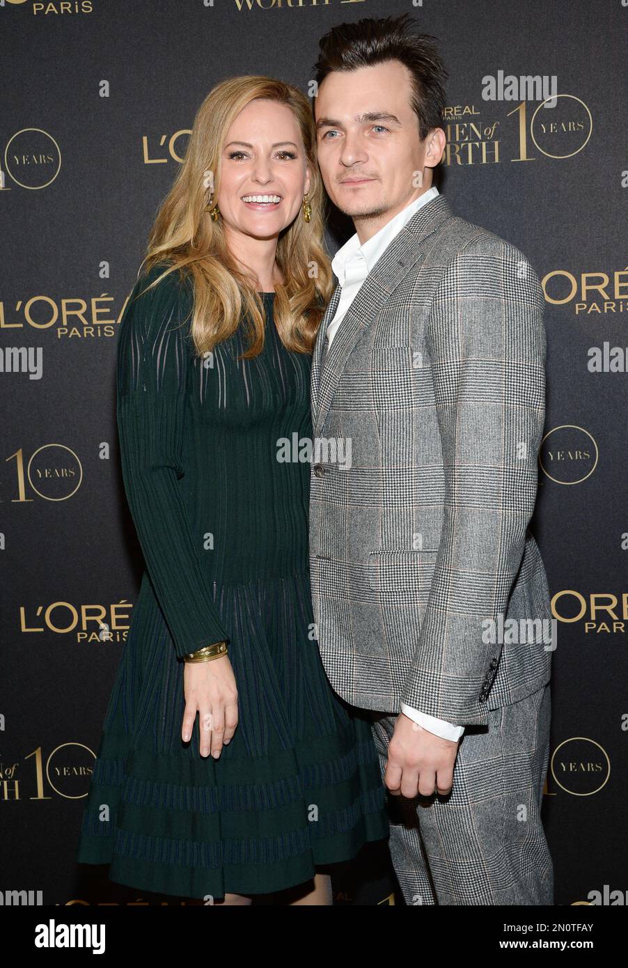 Actress and athlete Aimee Mullins, left, poses with fiancé actor Rupert ...
