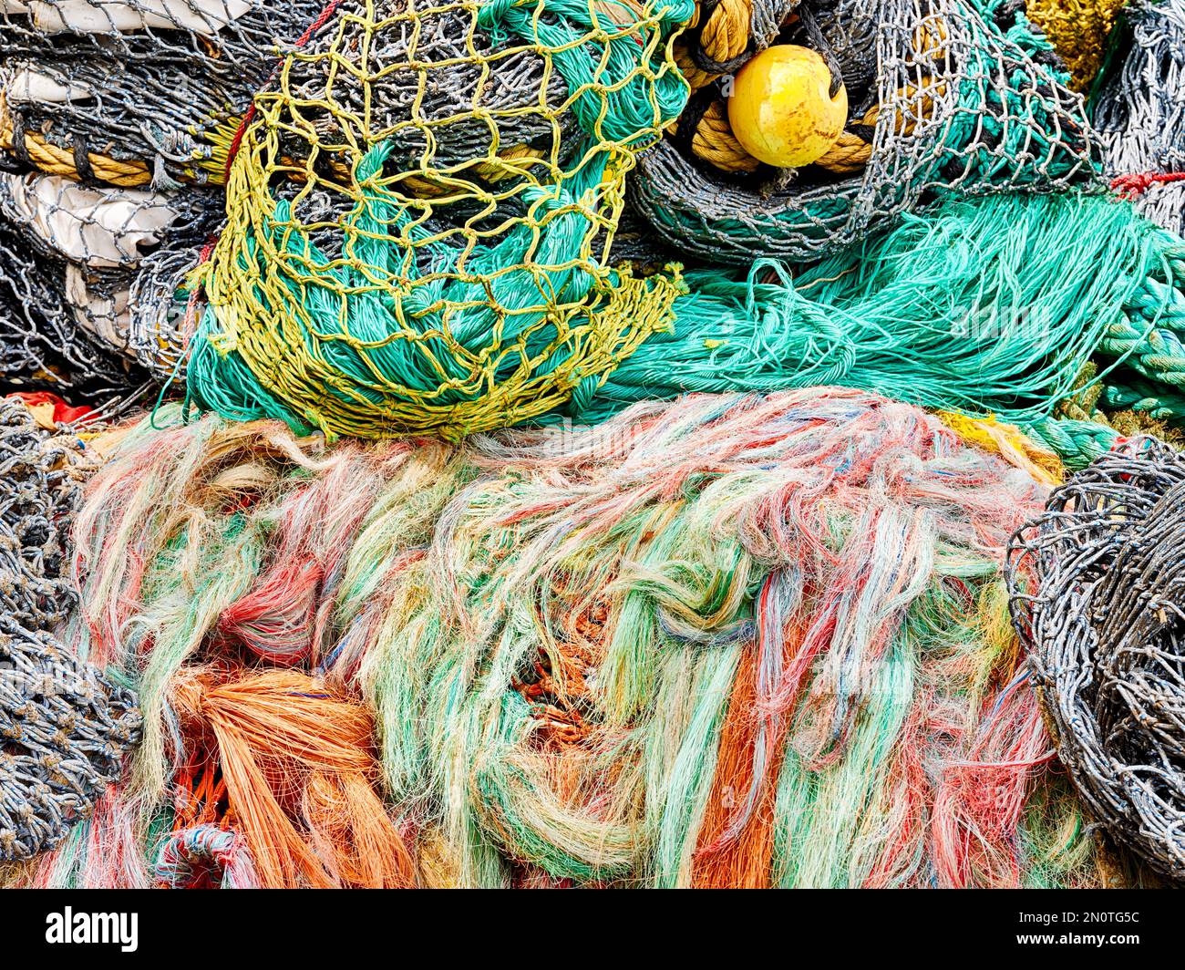 Fish nets and floats are heaped together for storage at Fisherman's ...