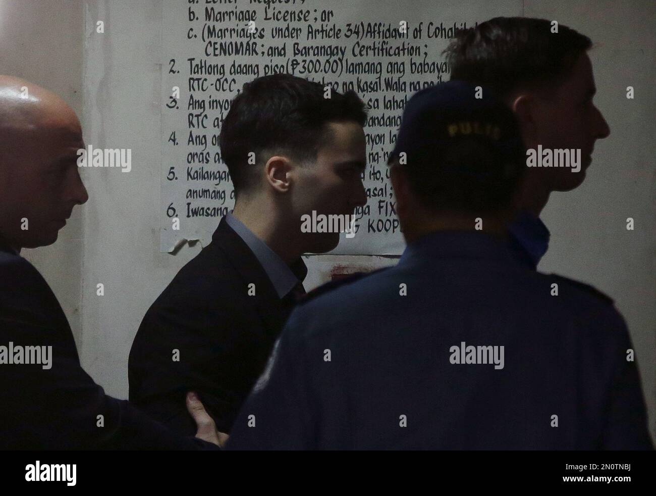 U.S. Marine Lance Cpl. Joseph Scott Pemberton, center, accused of ...