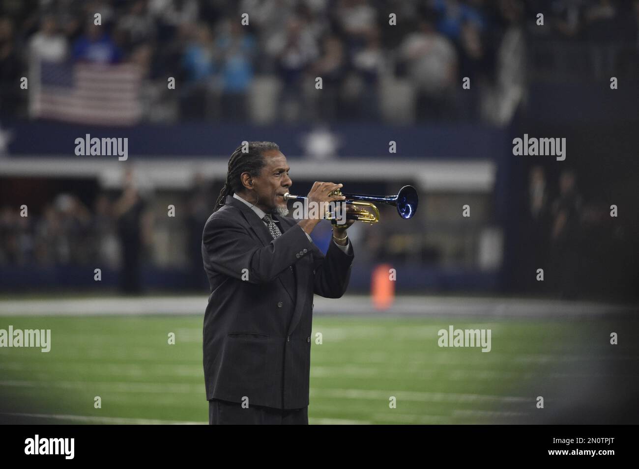 Trumpet player Freddie Jones plays the national anthem during an NFL ...