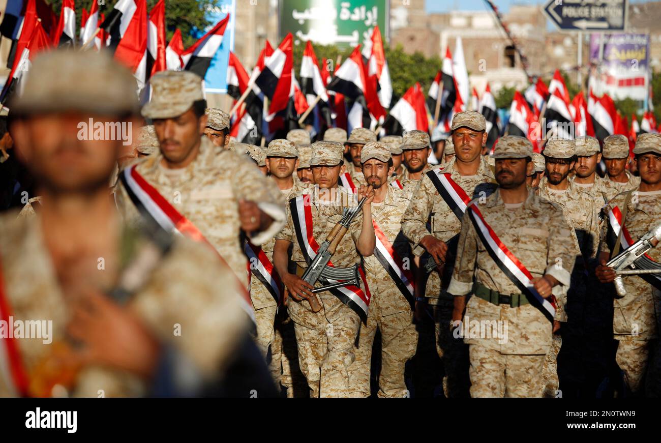 Shiite fighters, known as Houthis, wearing army uniforms march during a ...