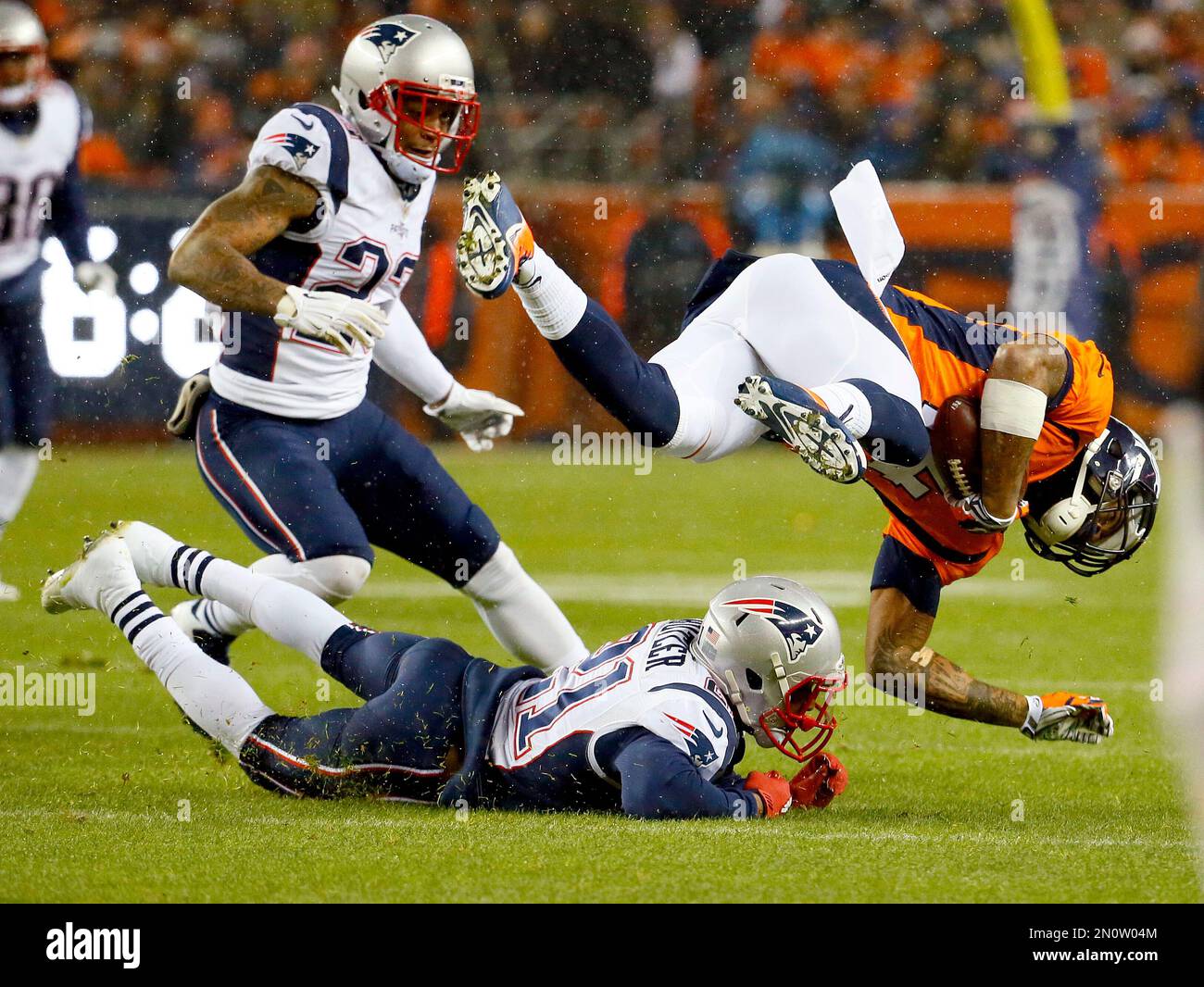 New England Patriots cornerback Malcolm Butler (21) hits Denver Broncos ...