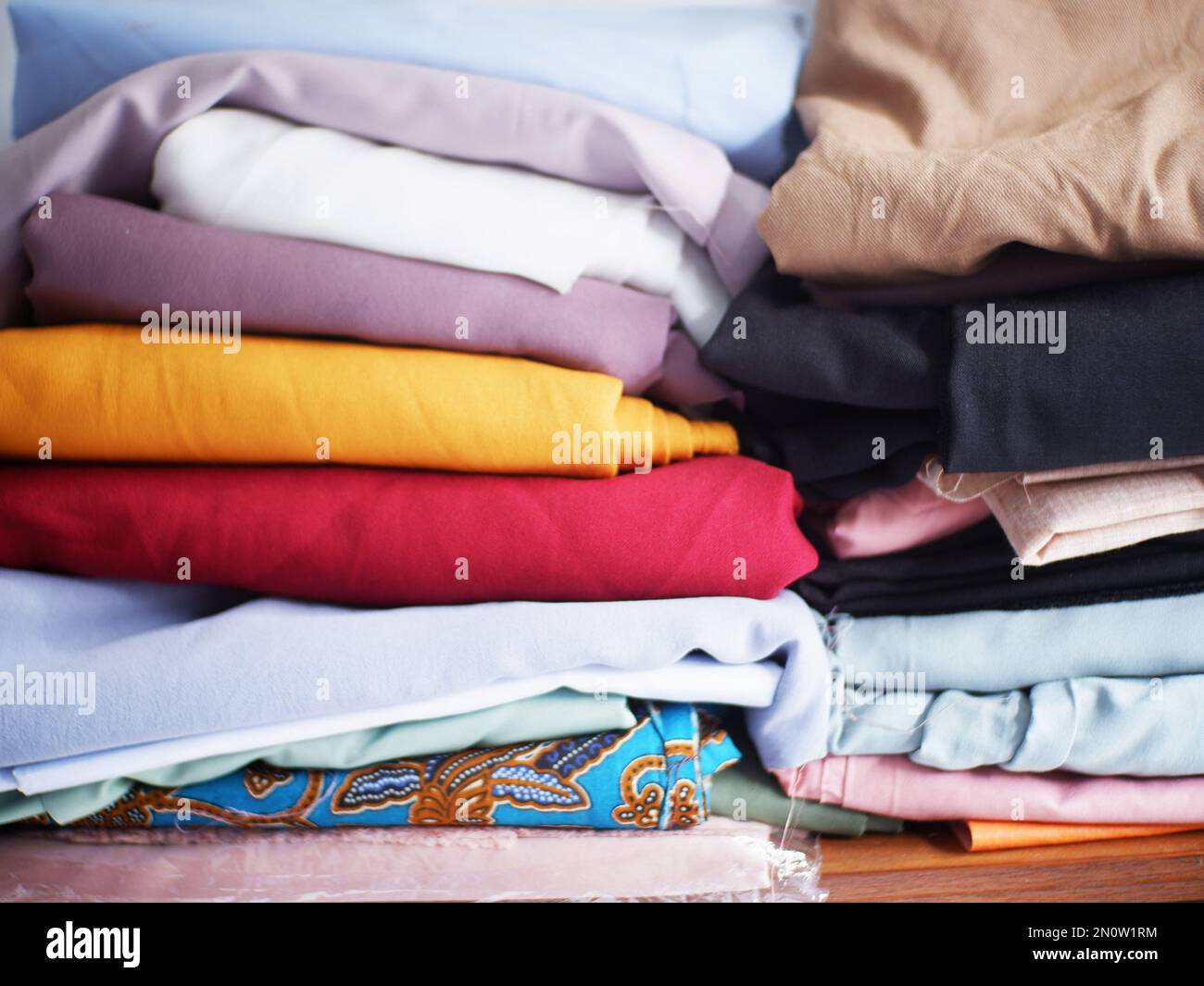 Woman clean clothes closet hi-res stock photography and images - Alamy