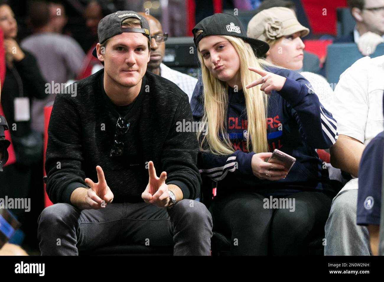 Meghan Trainor, right and brother Ryan Trainor attend the game between the Los Angeles Clippers ...