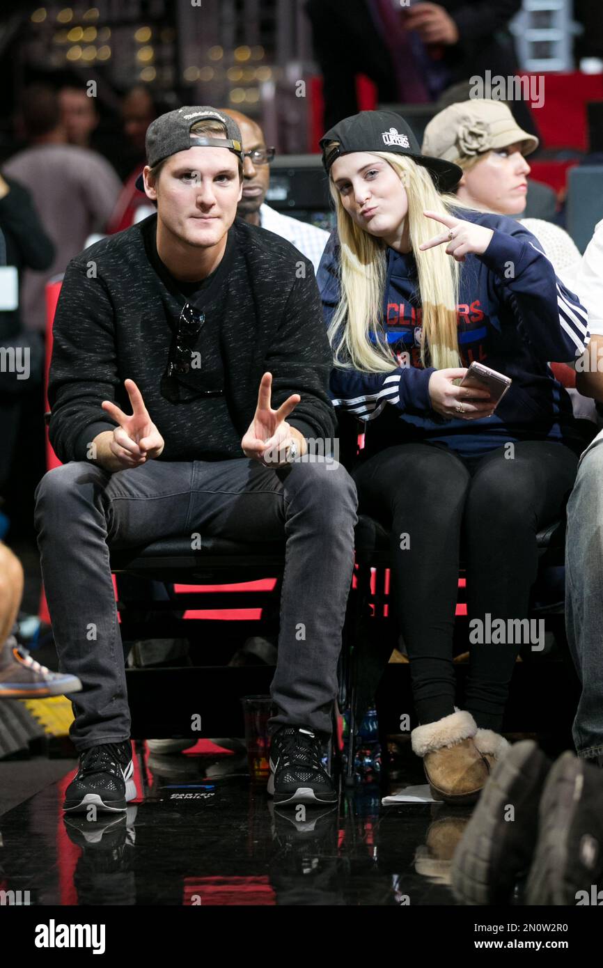 Meghan Trainor, right and brother Ryan Trainor attend the game between the Los Angeles Clippers ...