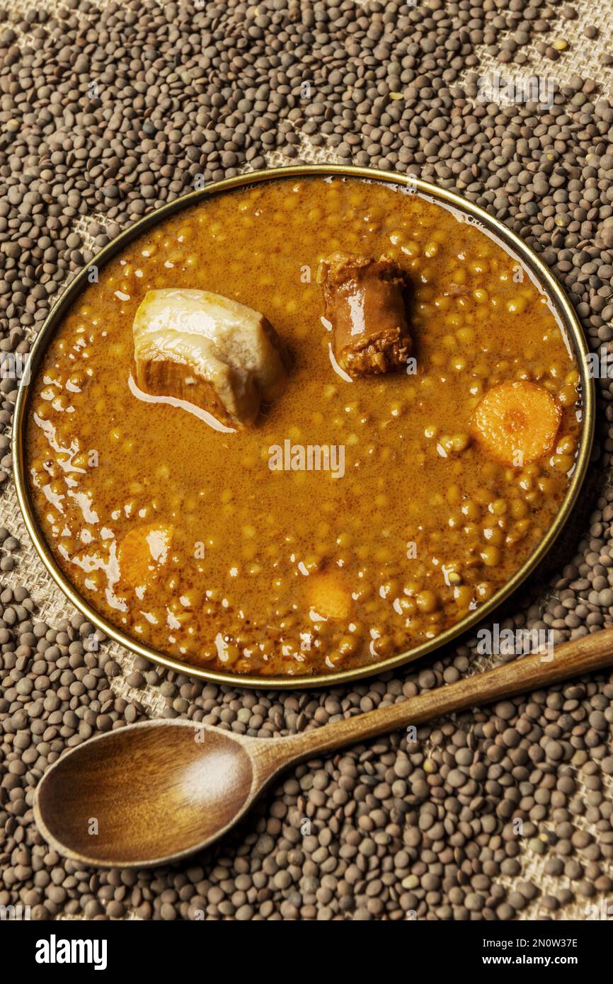 Traditional recipe for stewed lentils with chorizo and vegetables in a ...
