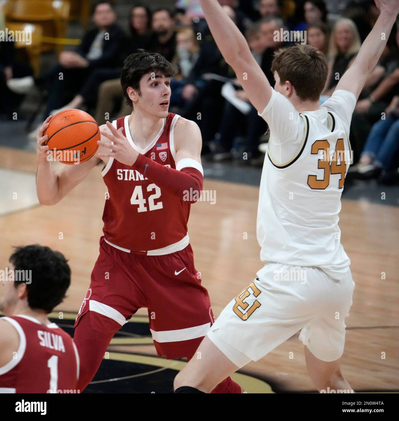 Stanford forward Maxime Raynaud, left, looks to pass the ball as ...