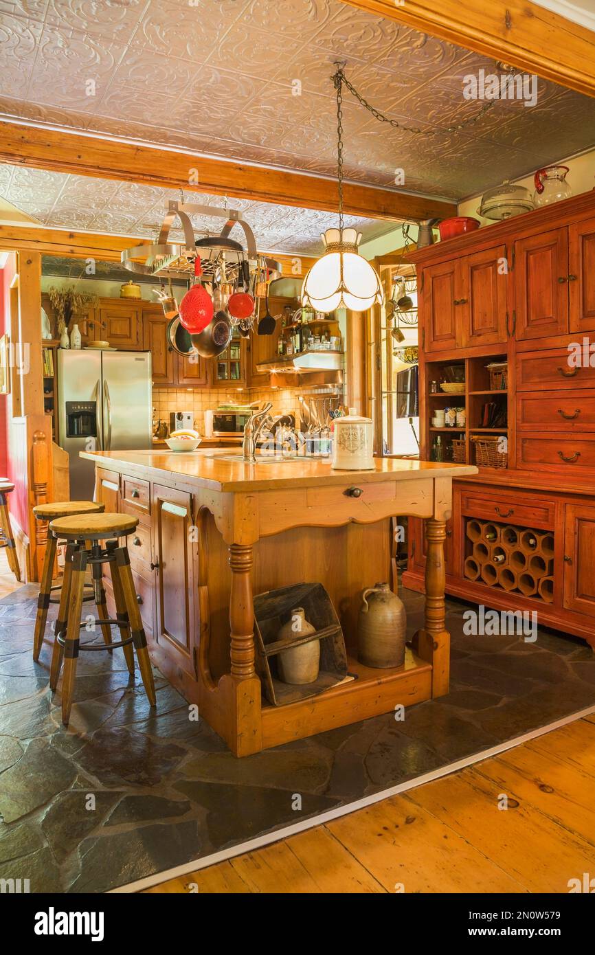 Kitchen with antique pine wood island, buffet, cabinets, slate floor ...