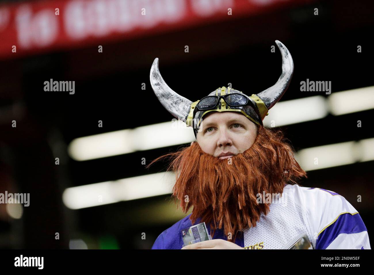A Minnesota Vikings fan watches teams warm up before the first half of ...