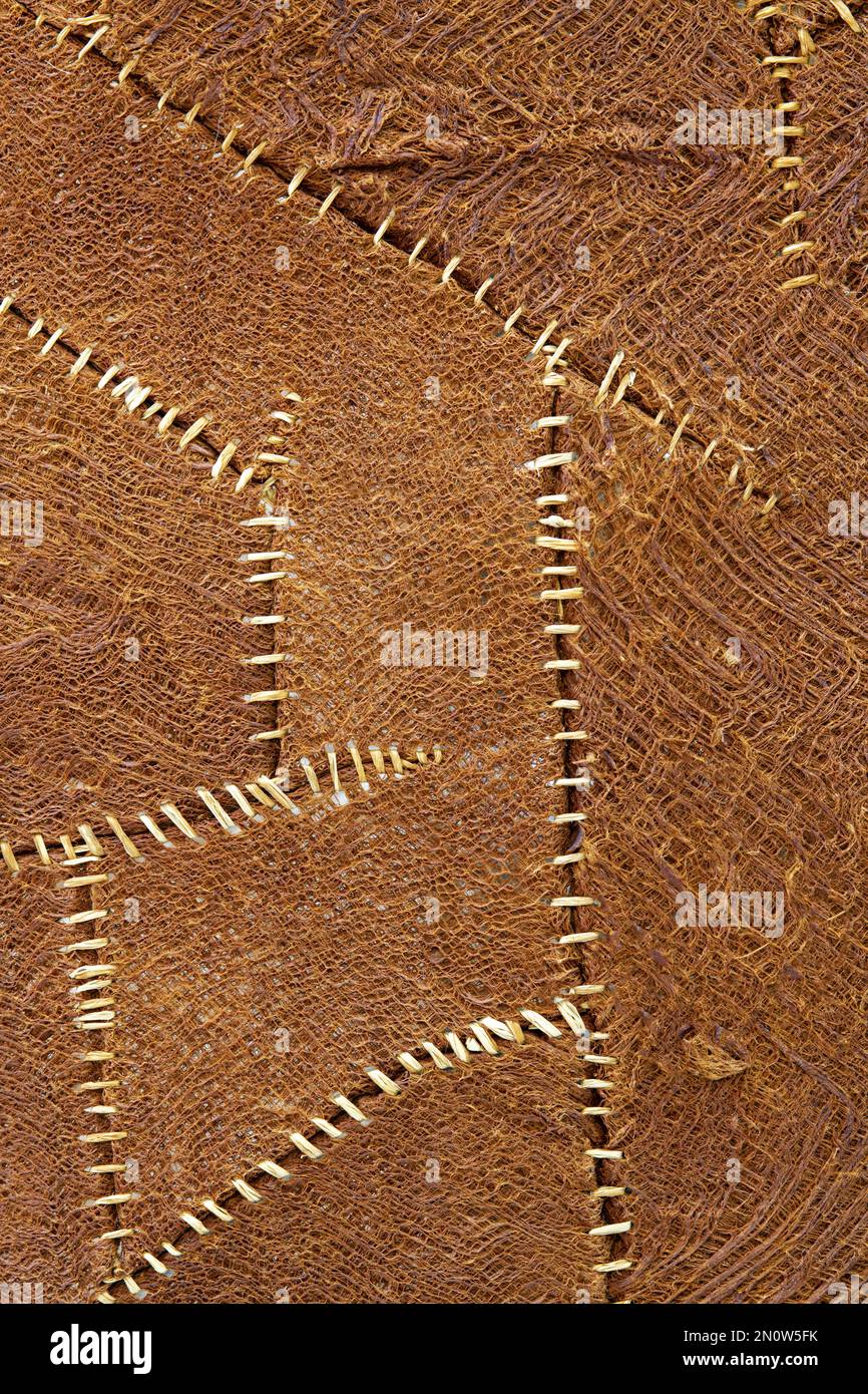 Rare brown cloth sewn with white string. fabric background texture ...