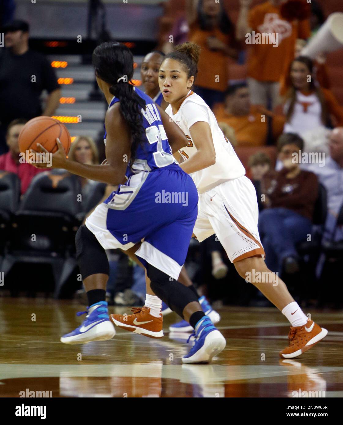 Texas guard Brooke McCarty, right, guards Hampton guard Chanel Green ...