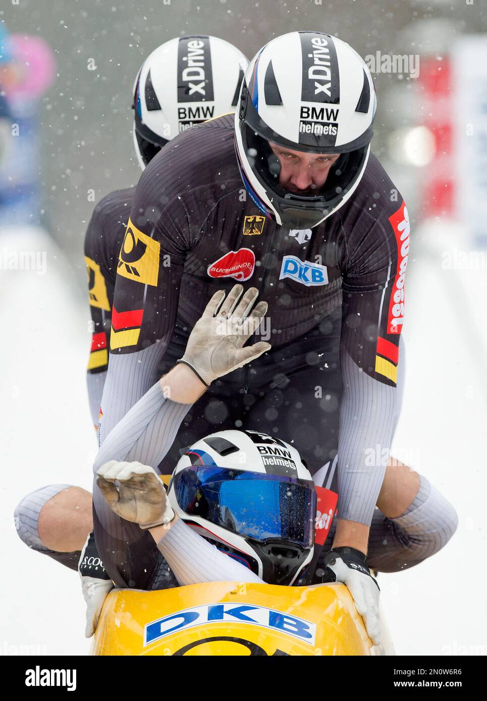 Germany's bob pilot Francesco Friedrich, front, and his team celebrate ...