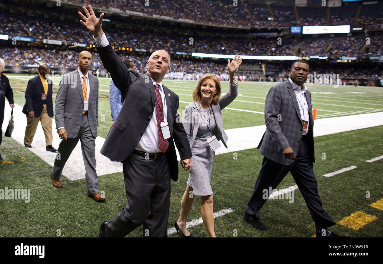 Louisiana Gov.-elect John Bel Edwards and his wife, Donna, wave to the ...
