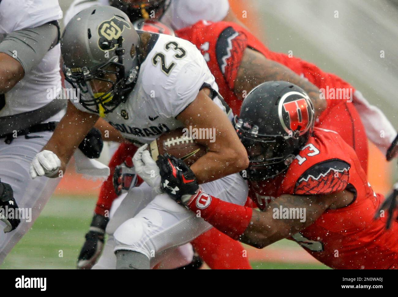 Utah linebacker Gionni Paul (13) tackles Colorado running back Phillip ...