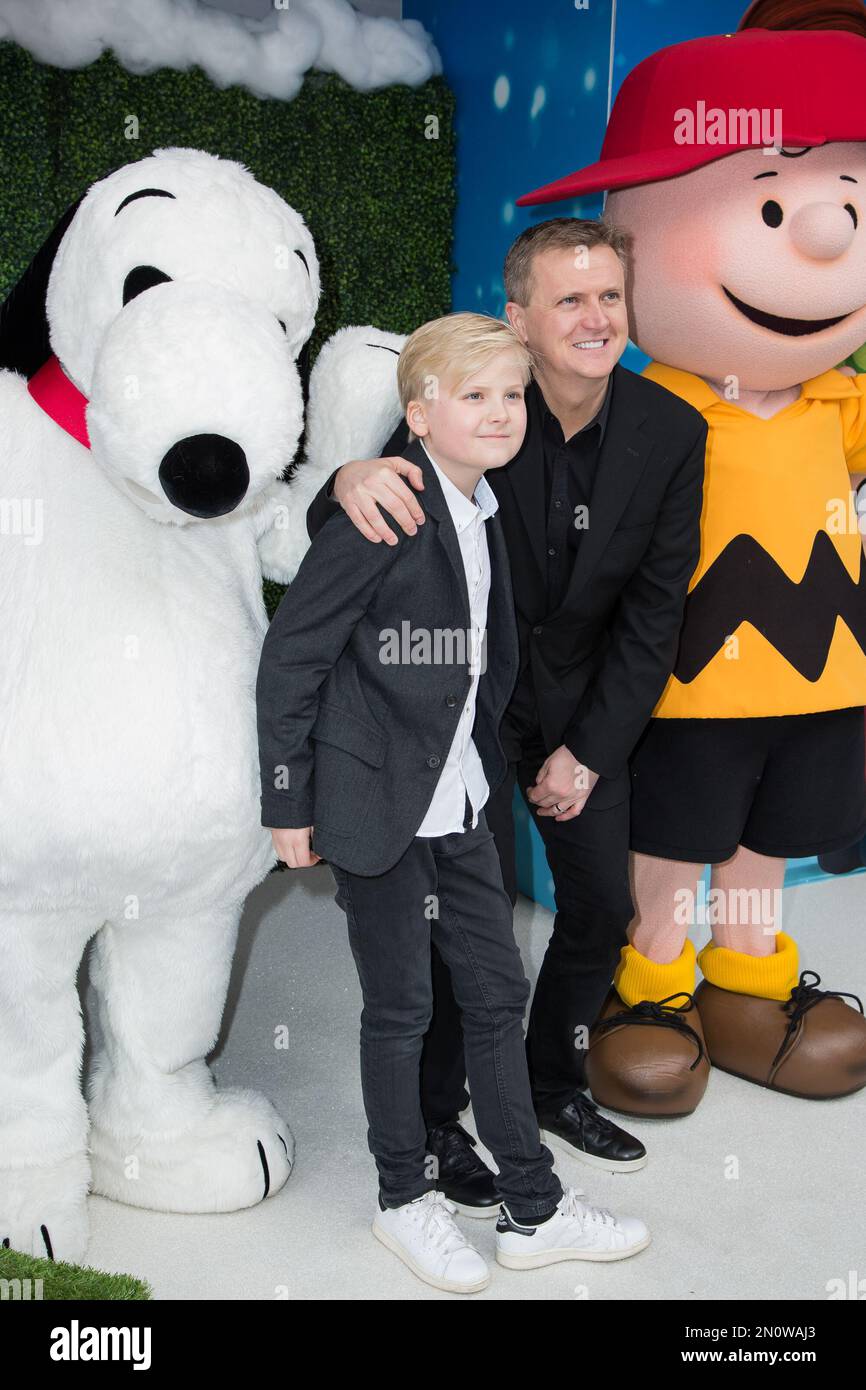 Aled Jones and his son pose for photographers upon arrival at the gala ...