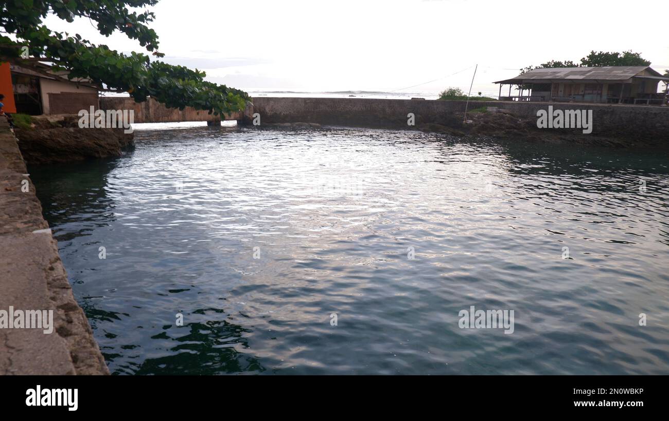 Afternoon sea view and sea-wall, beach, and coral, sunset background on ...