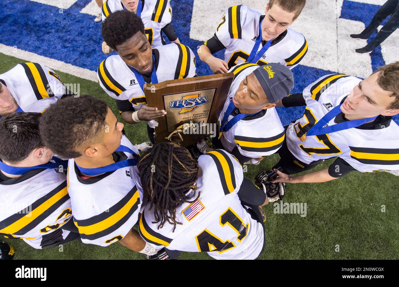 Fort Wayne Snider players take turns kissing the championship trophy ...