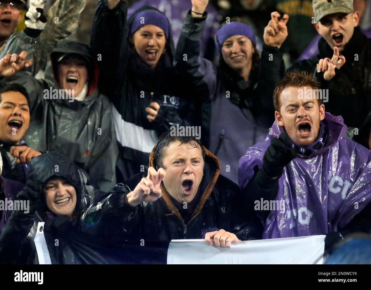 TCU fans cheer for their team during the first half of an NCAA college ...