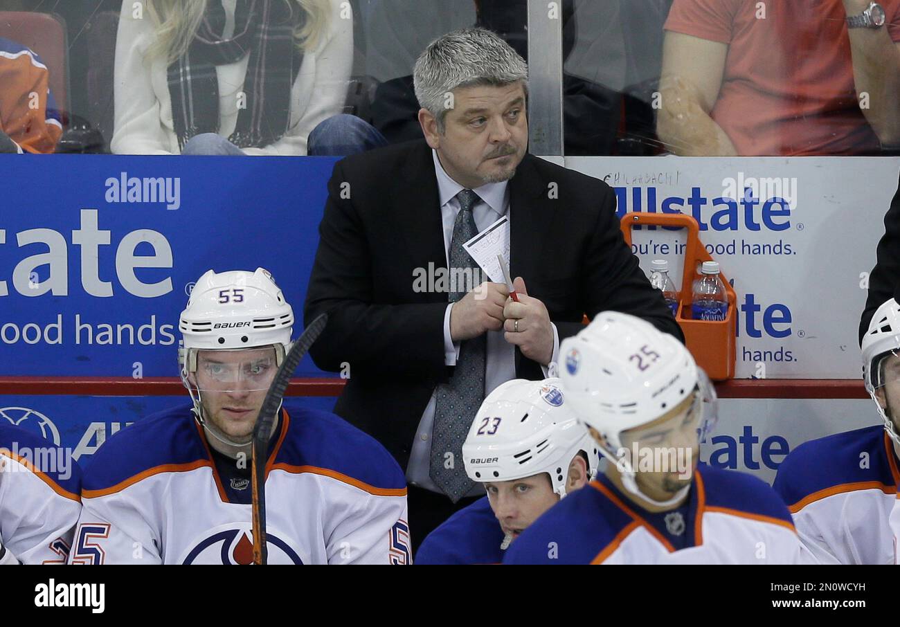 Edmonton Oilers head coach Todd McLellan watches from behind the bench ...