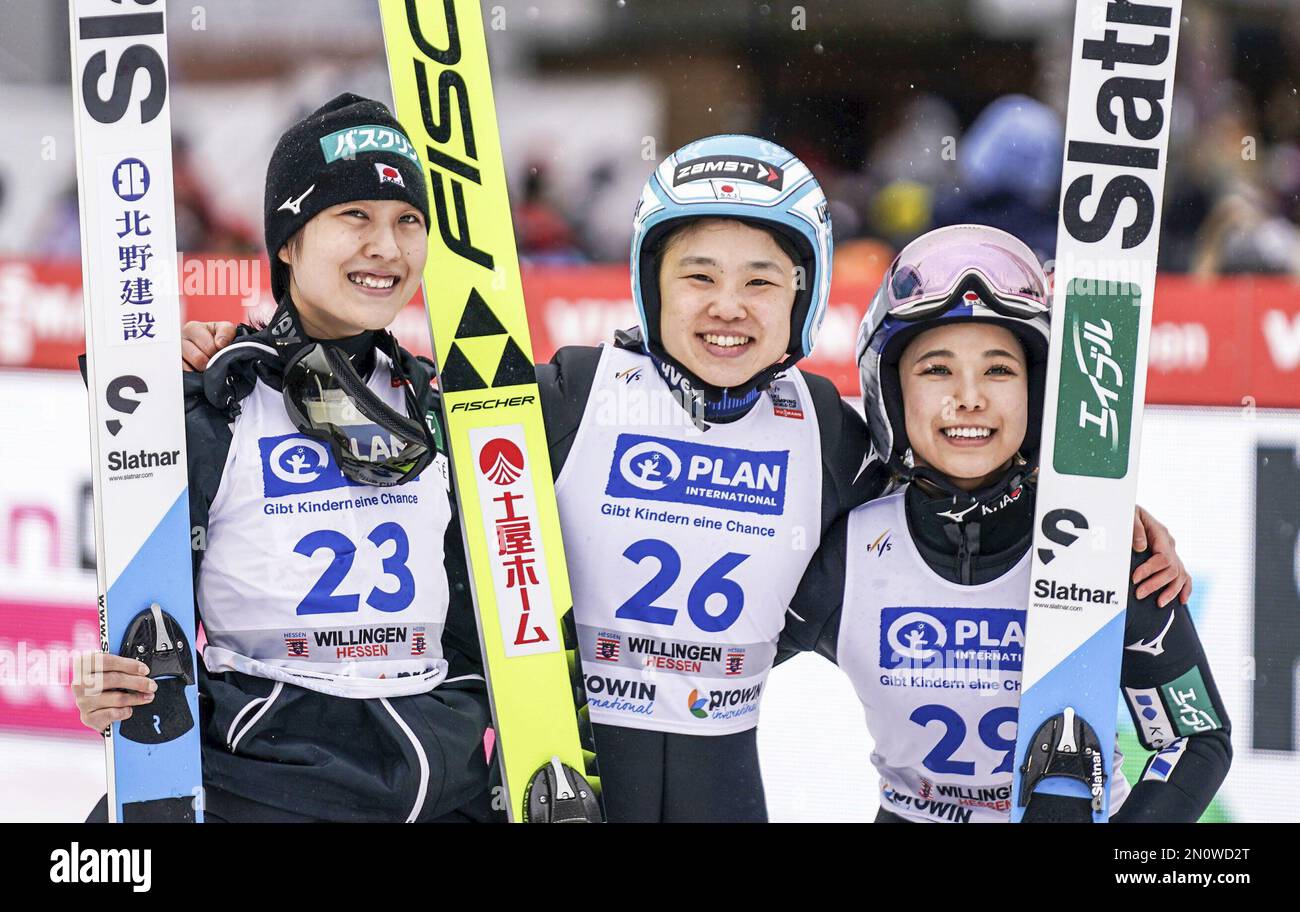 Japanese ski jumper Yuki Ito (C) poses after winning a World Cup event ...