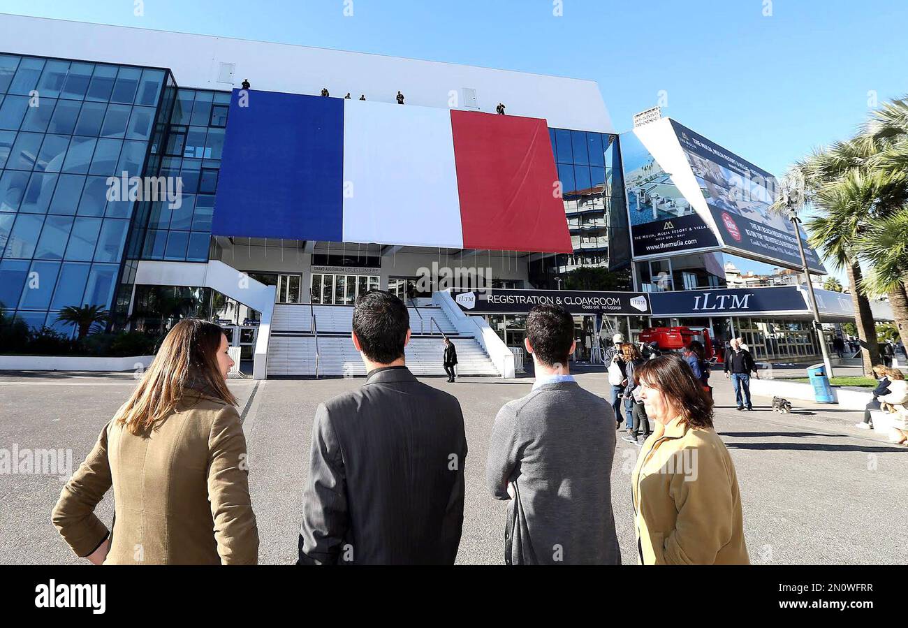 A giant French flag set up on the Cannes festival palace in Cannes ...
