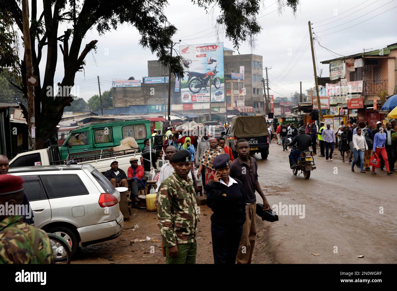 Soldiers and police officers patrol the streets of the Kangemi slum ...