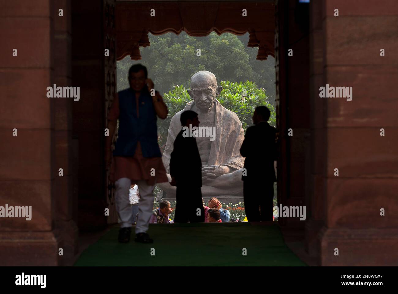 Indian security men stand guard at the entrance of Parliament house ...